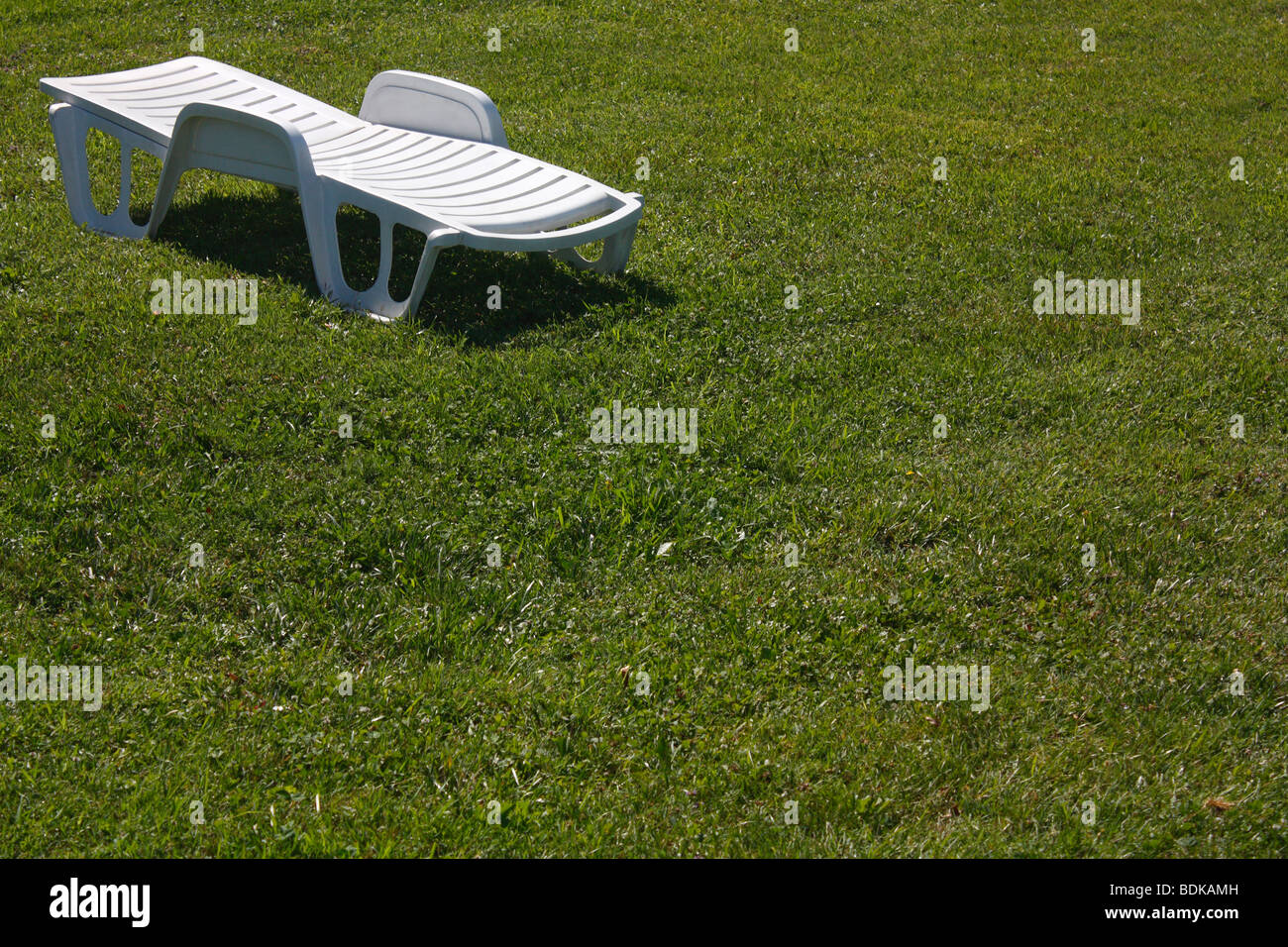 Folding chair on the lawn Stock Photo - Alamy