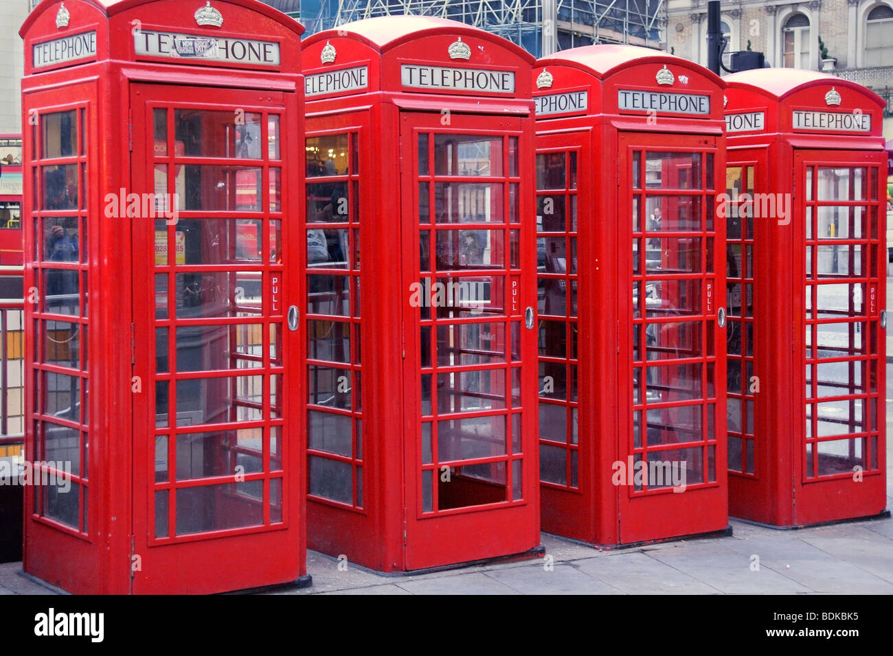 A row of four british red telephone boxes Stock Photo - Alamy