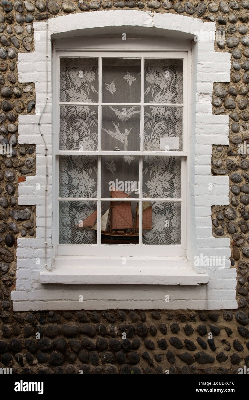Model ship in a seaside window Stock Photo - Alamy