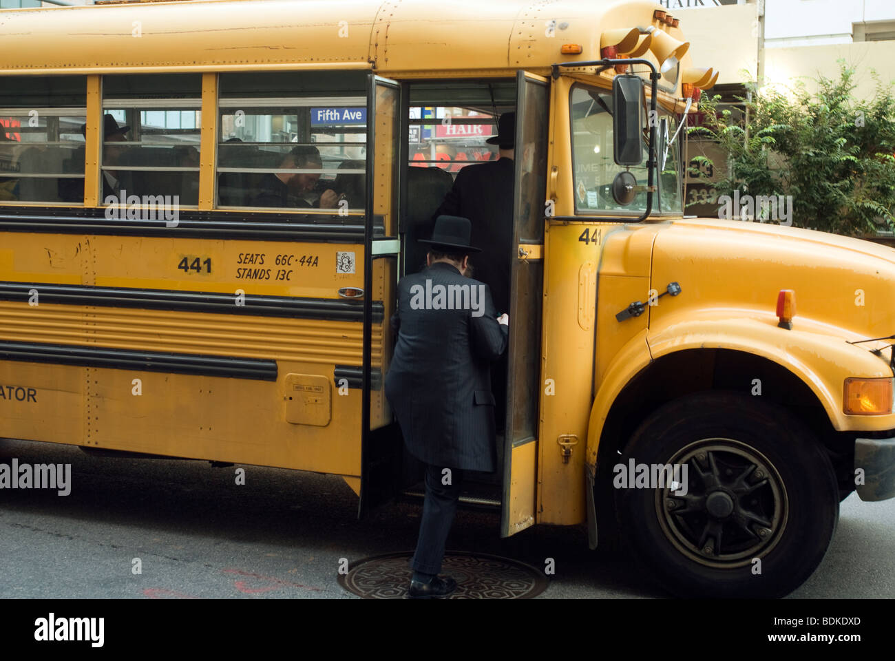 Orthodox Jewish men enter their own commuter bus in New York on on ...