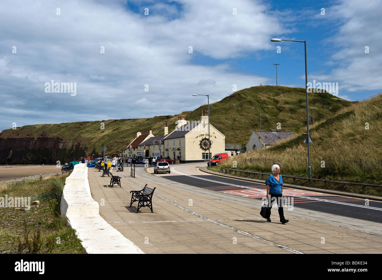 Woman Walking Along Saltburn Sea Front Stock Photo - Alamy