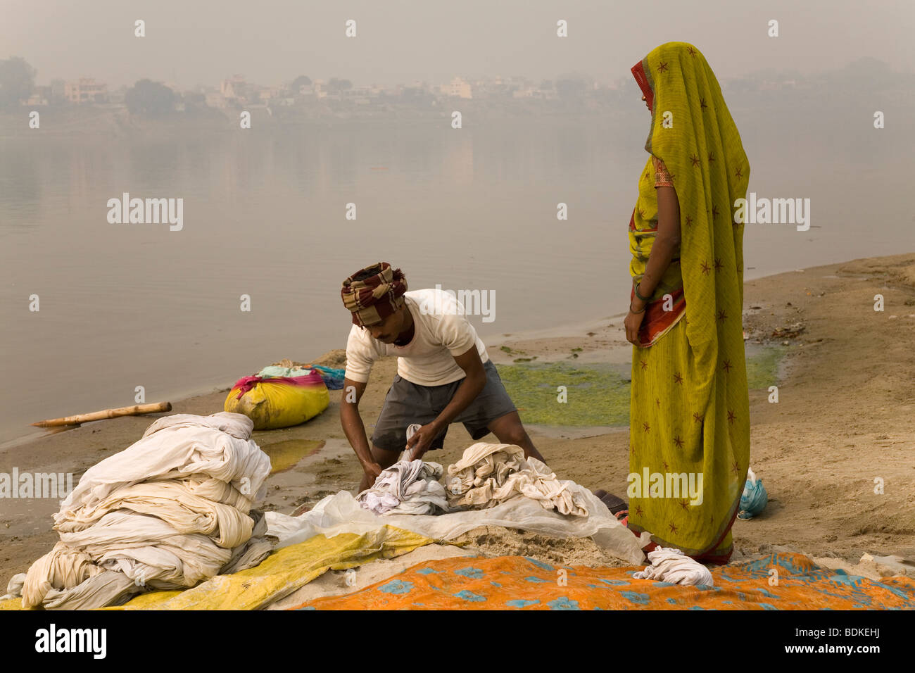 Indian man washing clothes on hi-res stock photography and images - Alamy