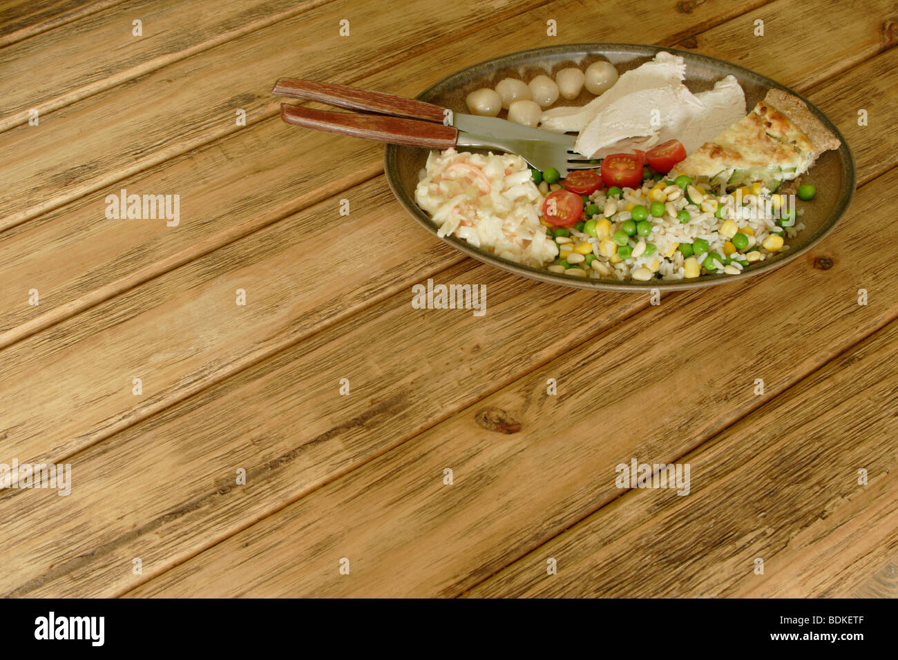 Selection of food on dinner plate Stock Photo - Alamy