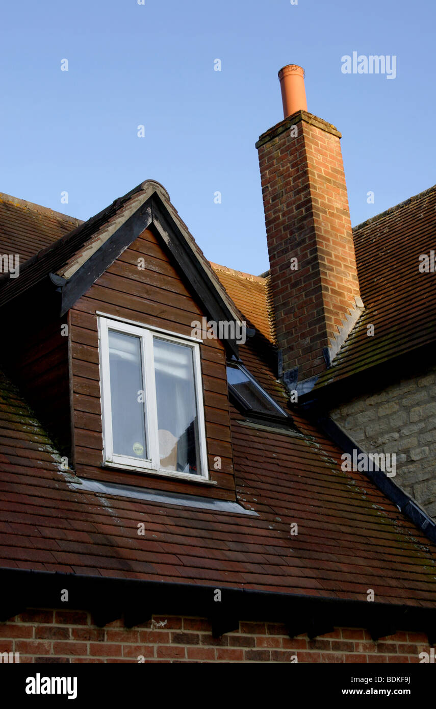 Chimney and window from house England UK Stock Photo - Alamy