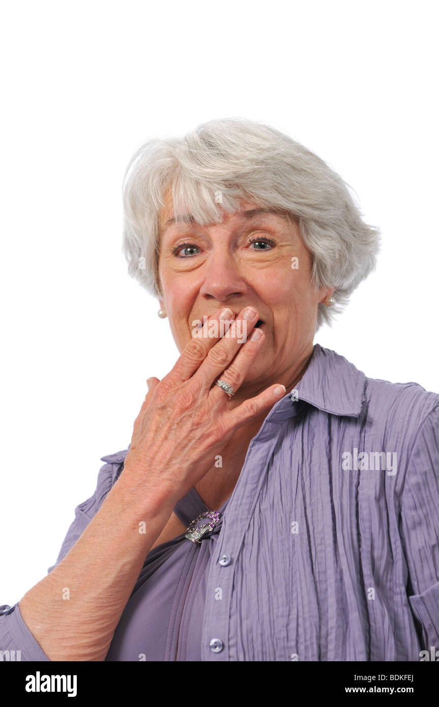 Senior lady showing surprise isolated on white Stock Photo - Alamy