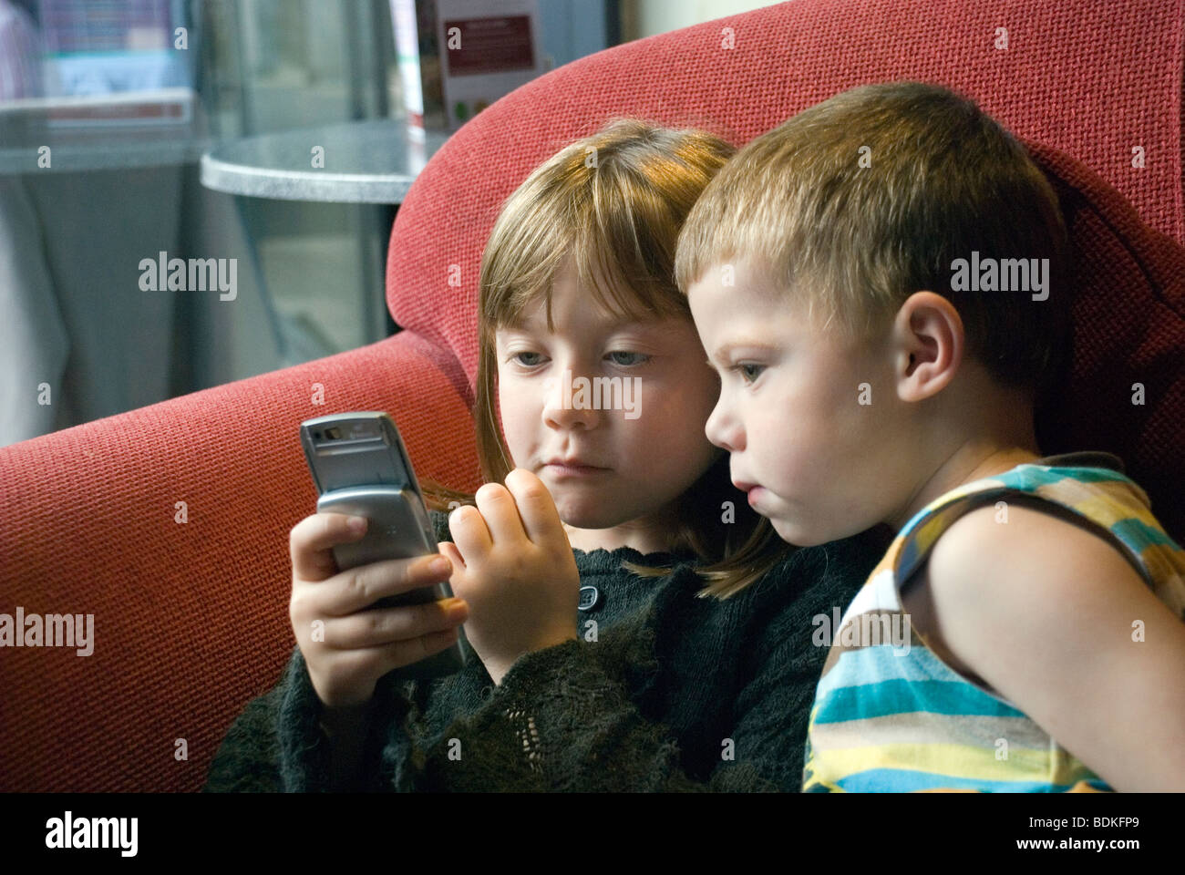 children texting or looking at a mobile phone,play, team, teamwork ...