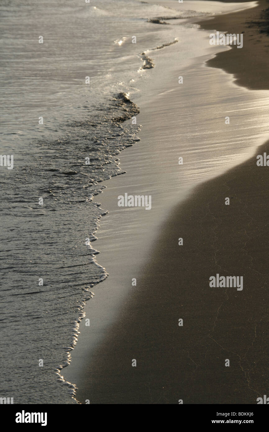 movement of sea waves on sand on beach coast shore Stock Photo - Alamy