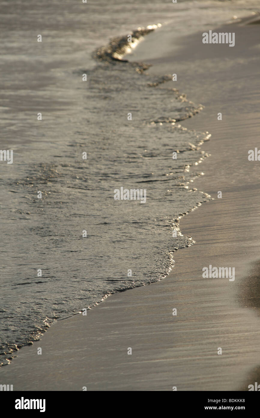 movement of sea waves on sand on beach coast shore Stock Photo - Alamy