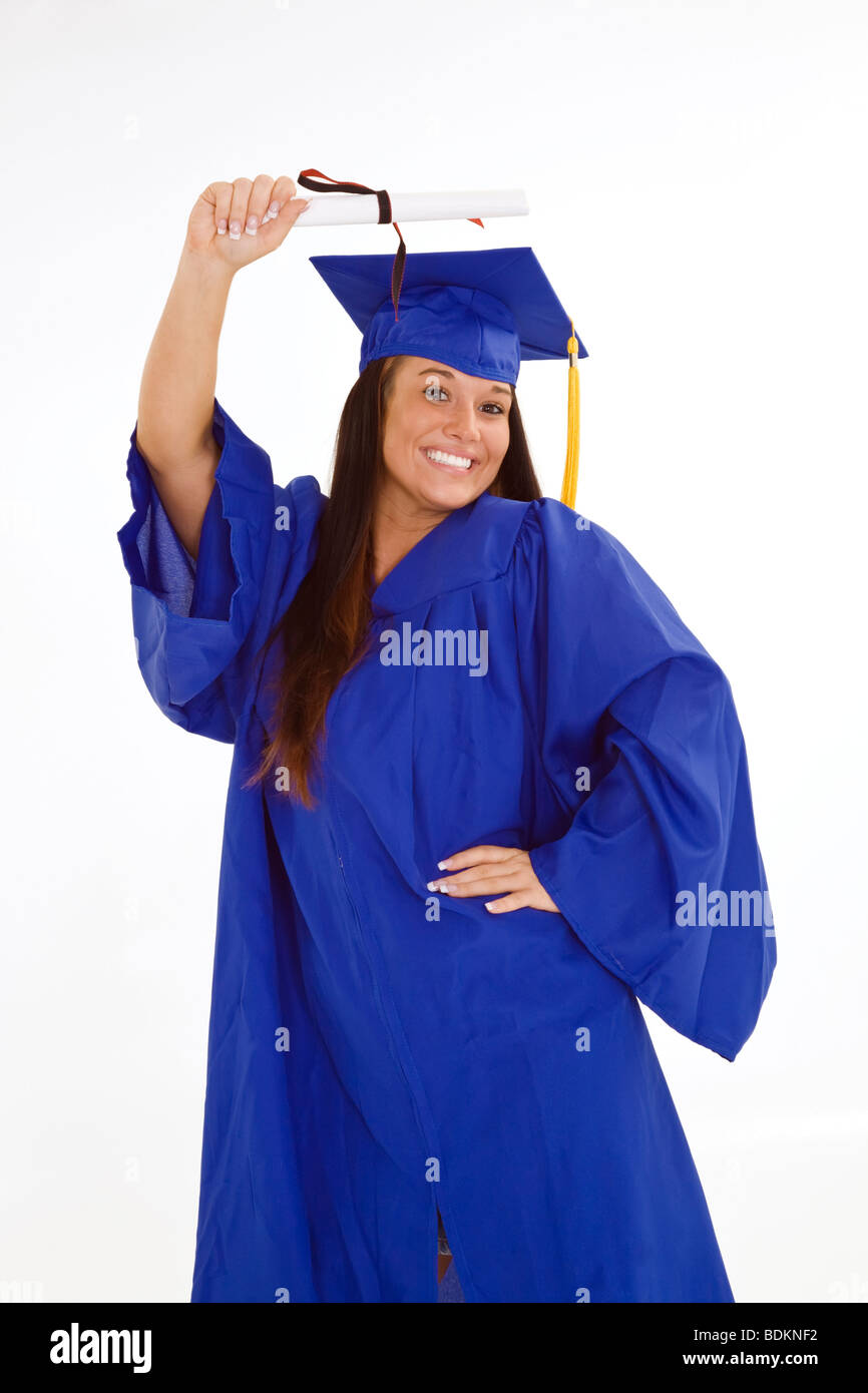 A beautiful Caucasian teenager in a graduation gown on a white ...