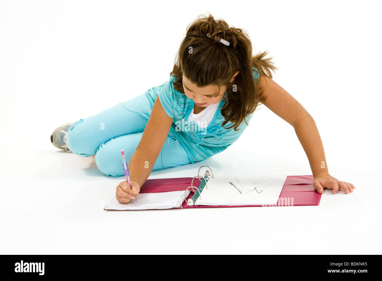 Child working on homework on white background Stock Photo - Alamy