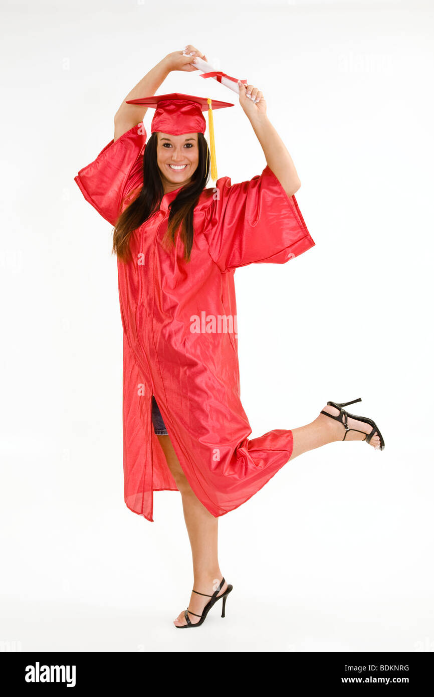 A female Caucasian in red graduation gown and very excited. She is on a ...