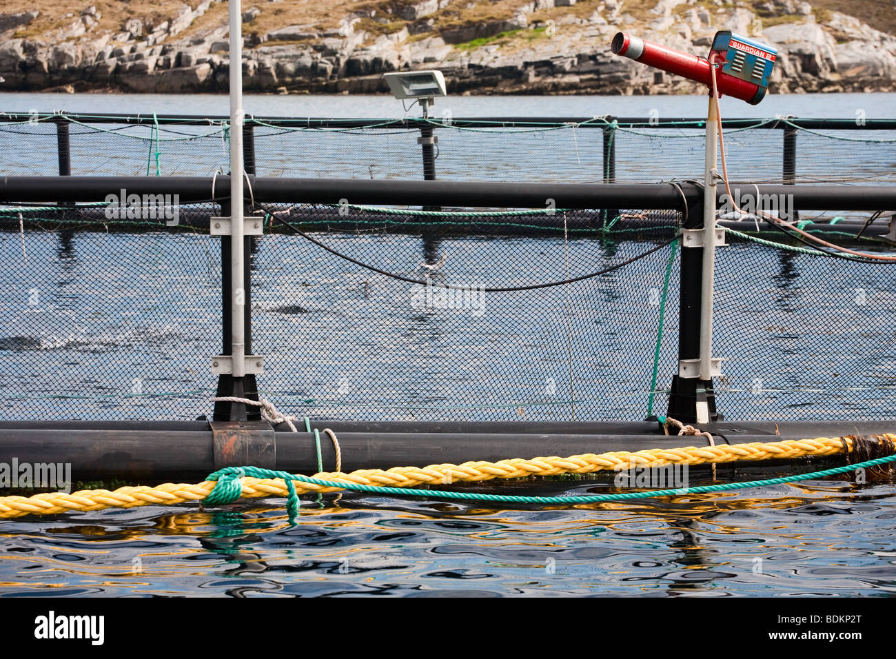 Fish farming with a gas gun to keep birds off Stock Photo - Alamy