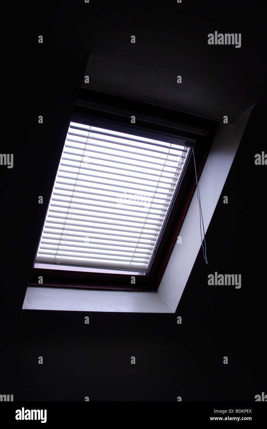 Skylight window in attic room with blind Stock Photo - Alamy