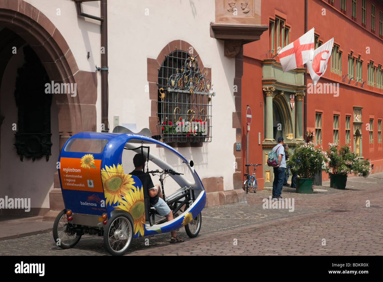 Sightseeing rickshaw bicycle waiting outside Old Town Hall and Tourist ...