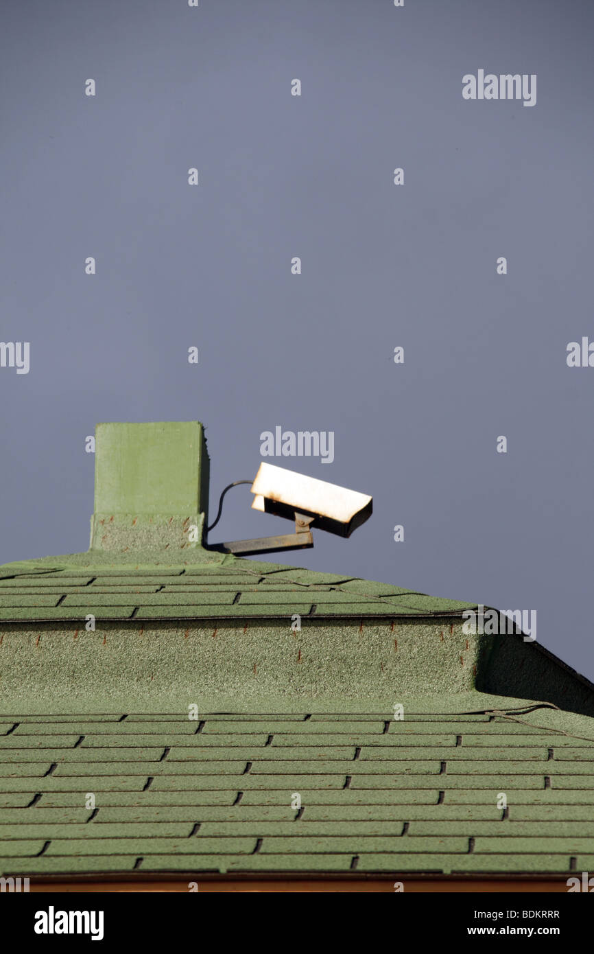 one cctv camera on property roof Stock Photo - Alamy
