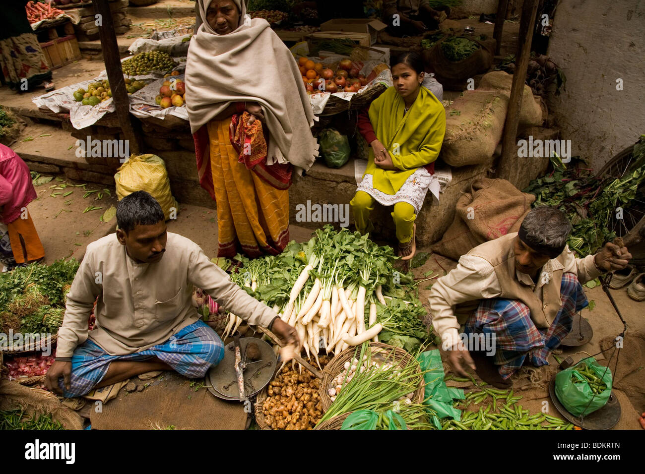 People work at a street market in Varanasi, India. They sell fresh vegetables Stock Photo - Alamy