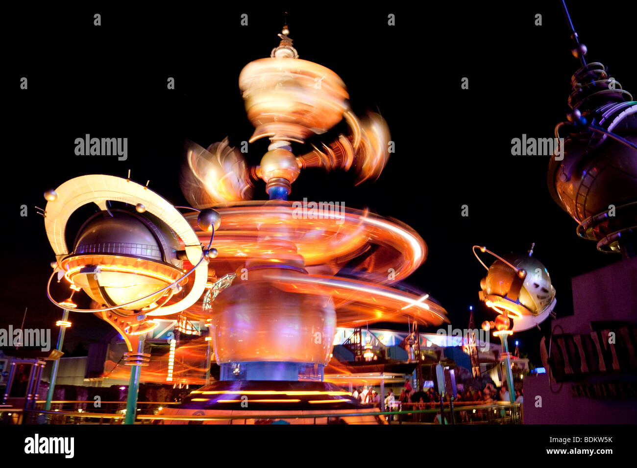 Disneyland Paris, the Rocket carousel merry go round at night in motion ...