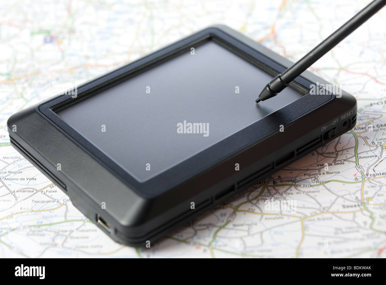 GPS global positioning system device arranged with map Stock Photo - Alamy