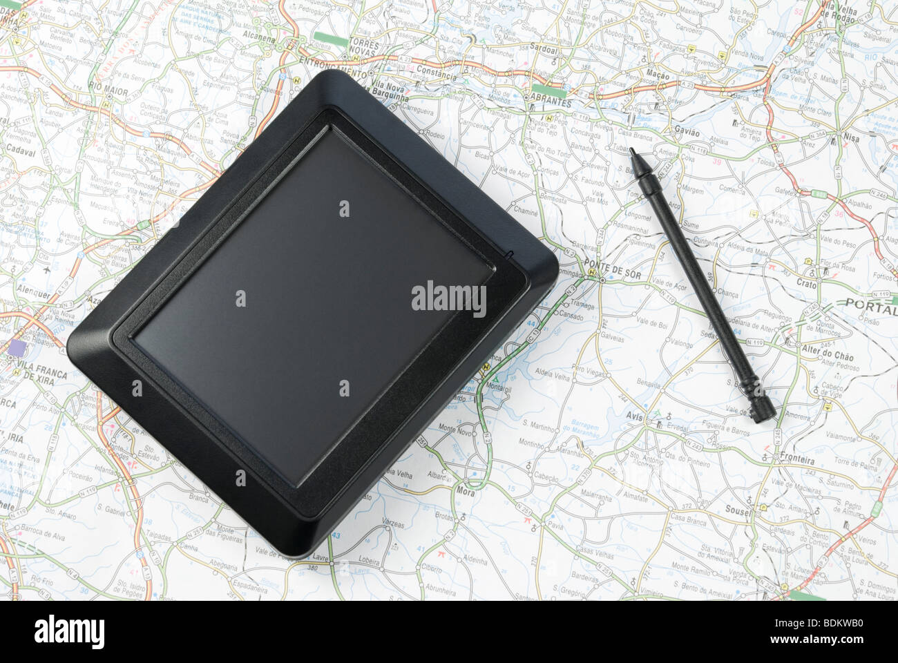 GPS global positioning system device arranged with map Stock Photo - Alamy
