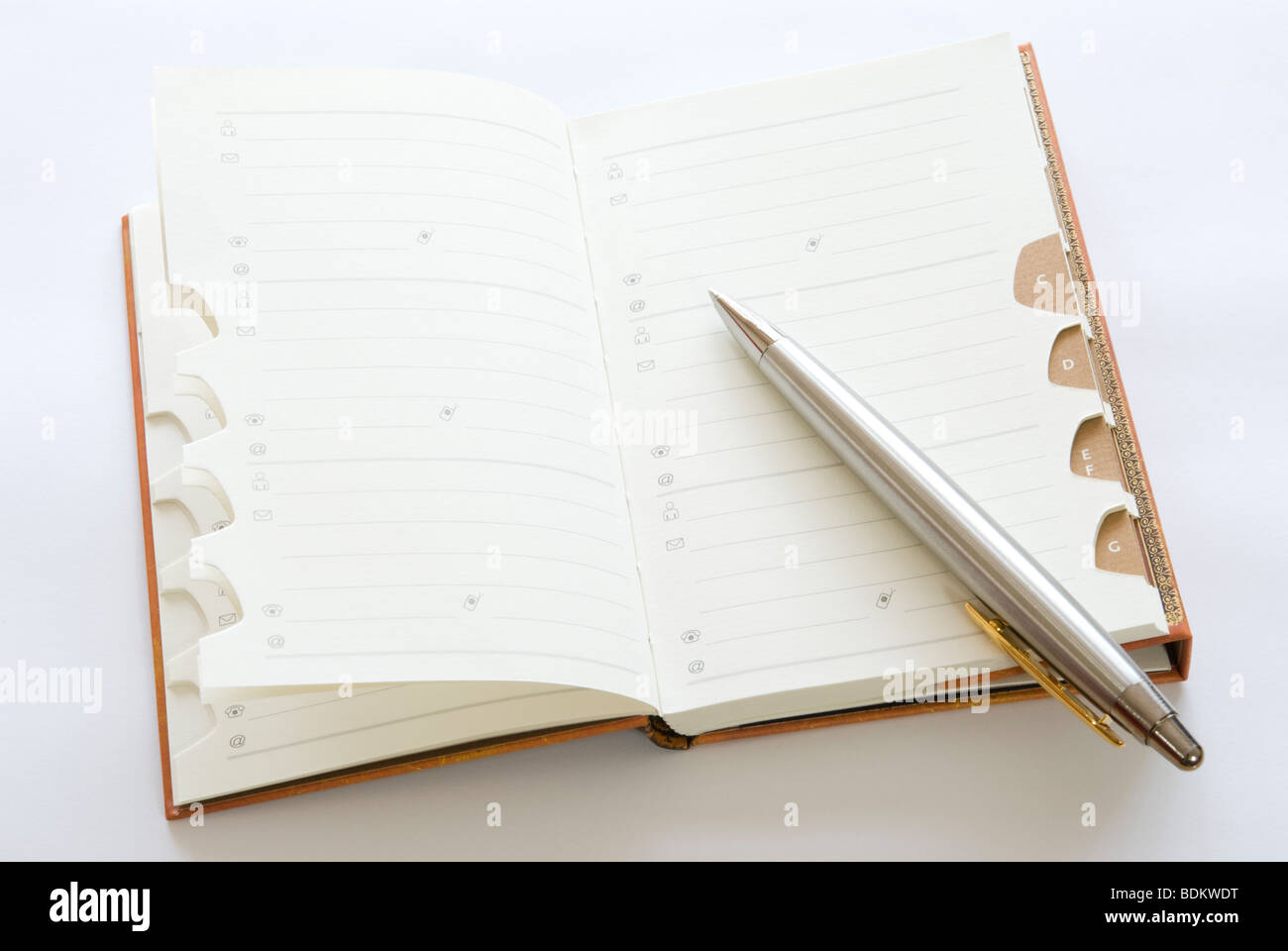 Address book with silver pen isolated on white background Stock Photo ...