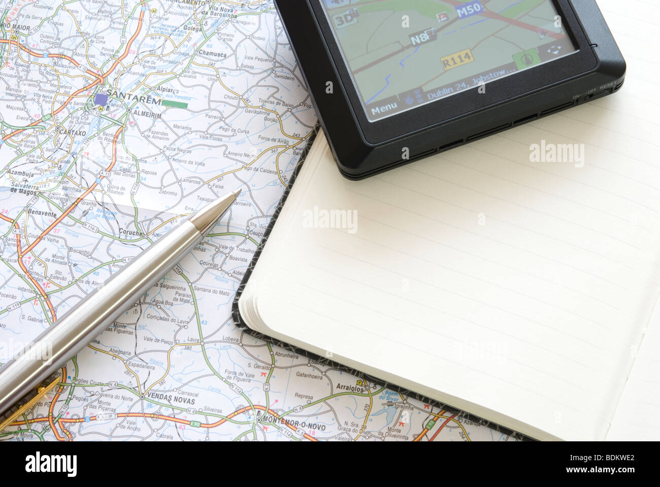 GPS global positioning system device arranged with map Stock Photo - Alamy