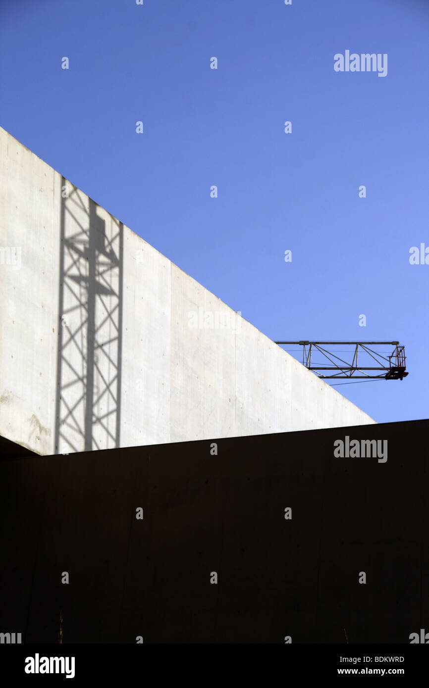 crane shadow on modern architecture building in sun Stock Photo - Alamy