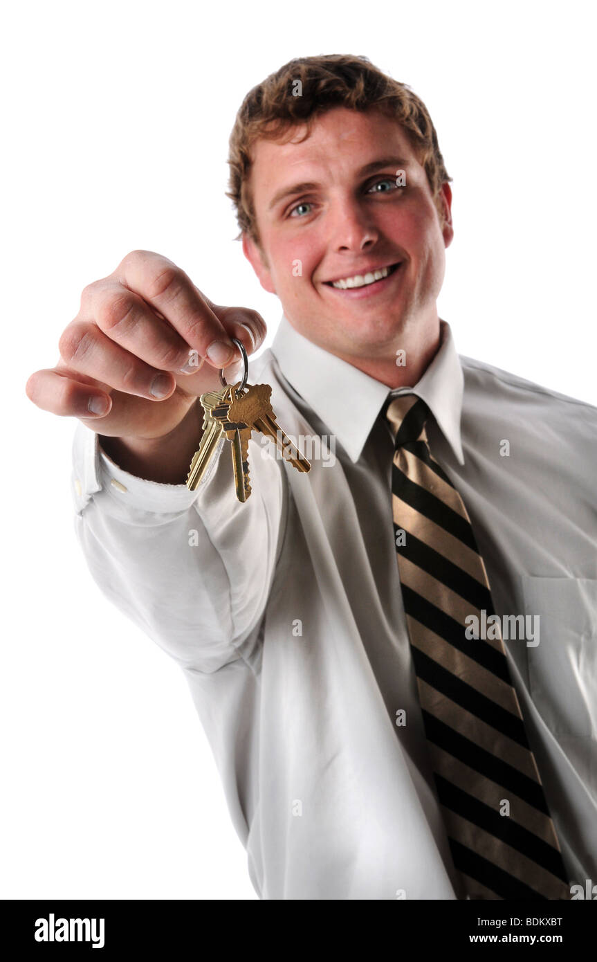 Portrait of businessman holding keys Stock Photo - Alamy
