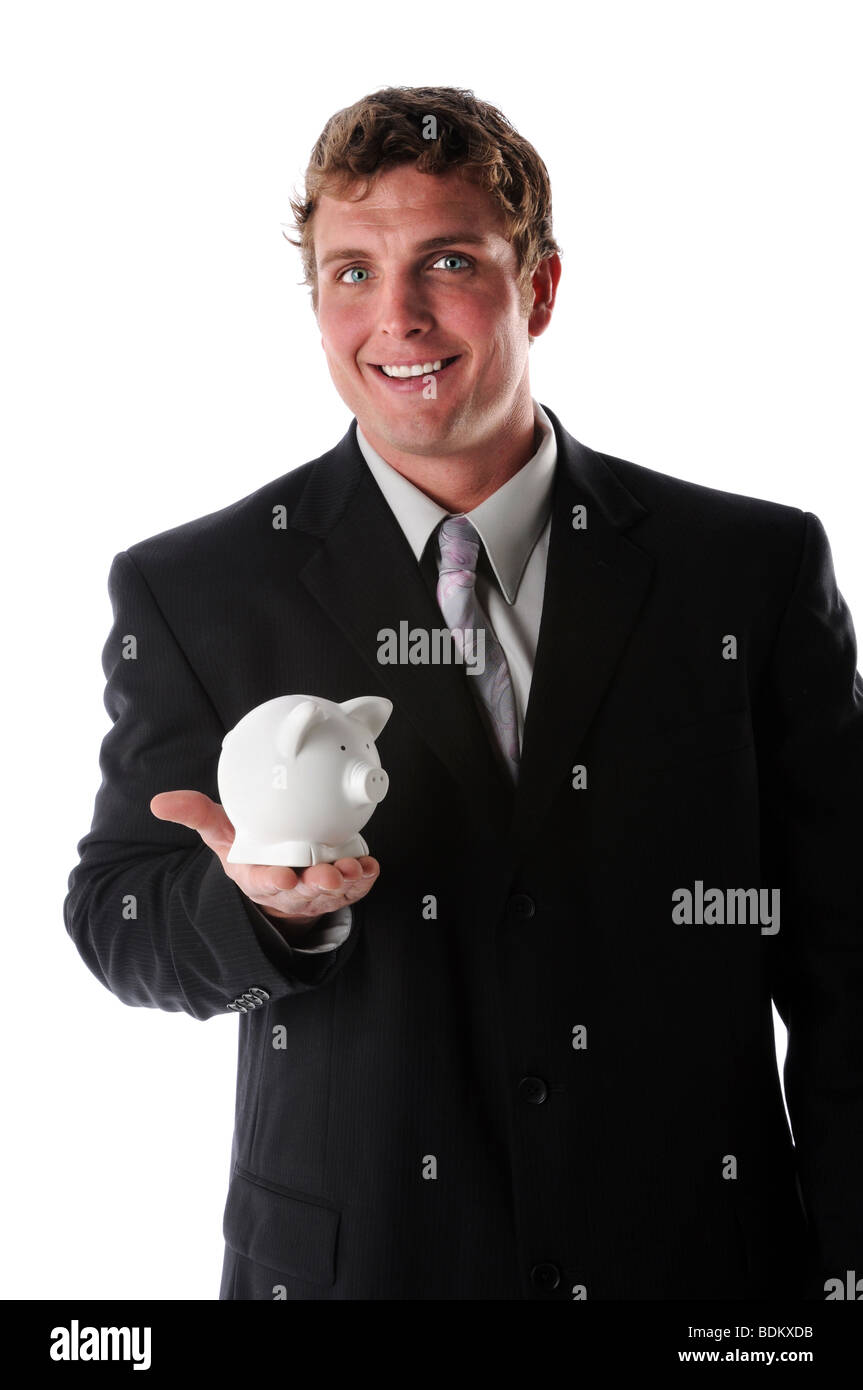 Man smiling and holding a piggy bank isolated over a white background ...