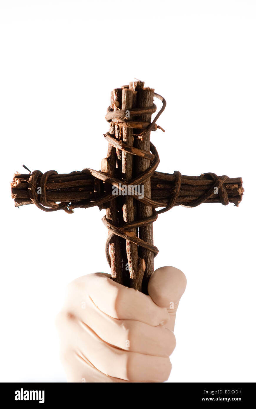 Hand in medical glove holding a wooden cross Stock Photo - Alamy