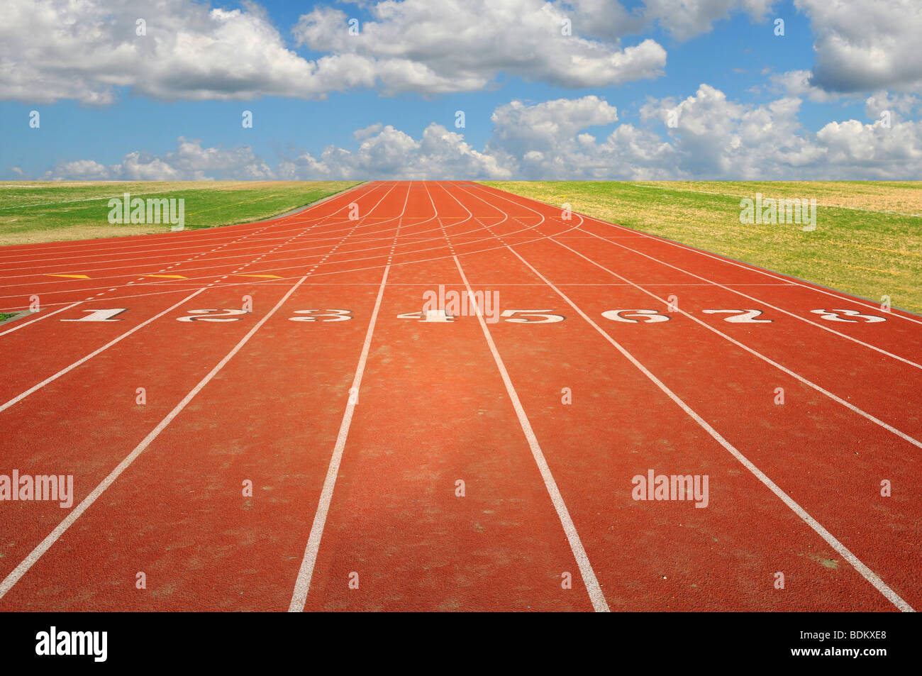 Running track with eight lanes with sky and clouds Stock Photo - Alamy