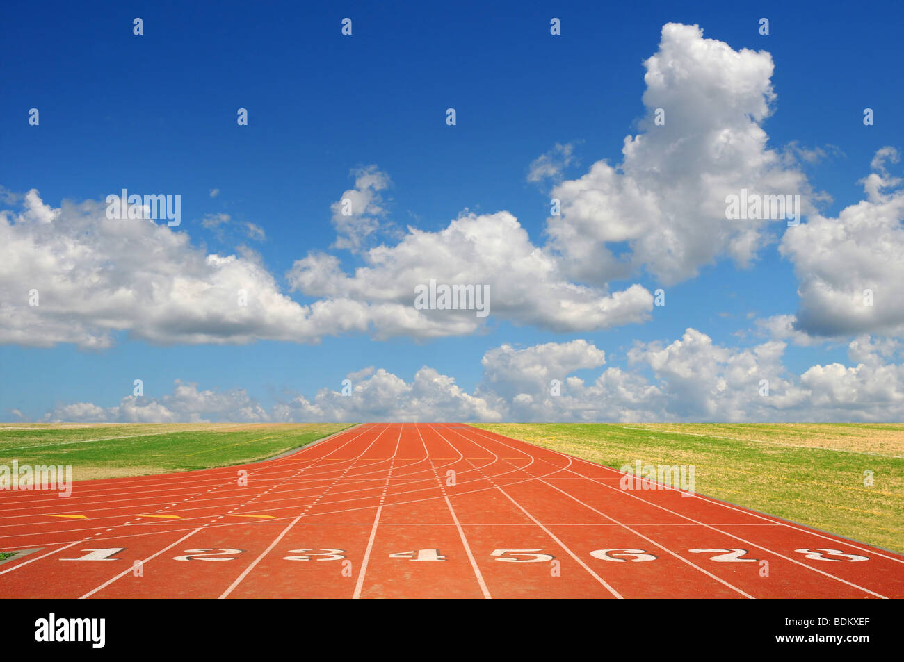 Running track with eight lanes with sky and clouds Stock Photo - Alamy