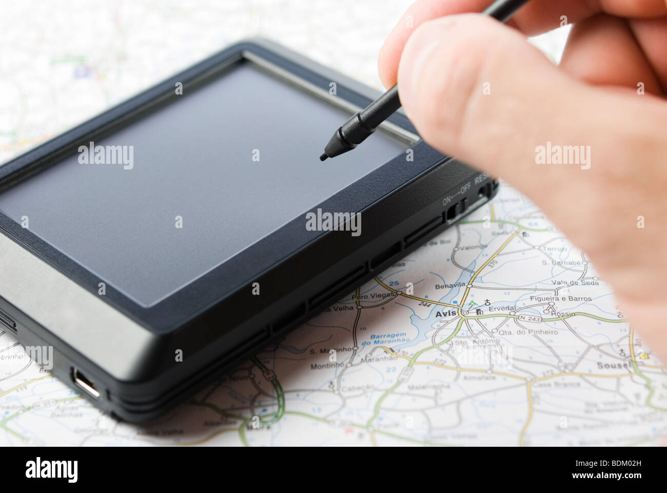 GPS global positioning system device arranged with map Stock Photo - Alamy