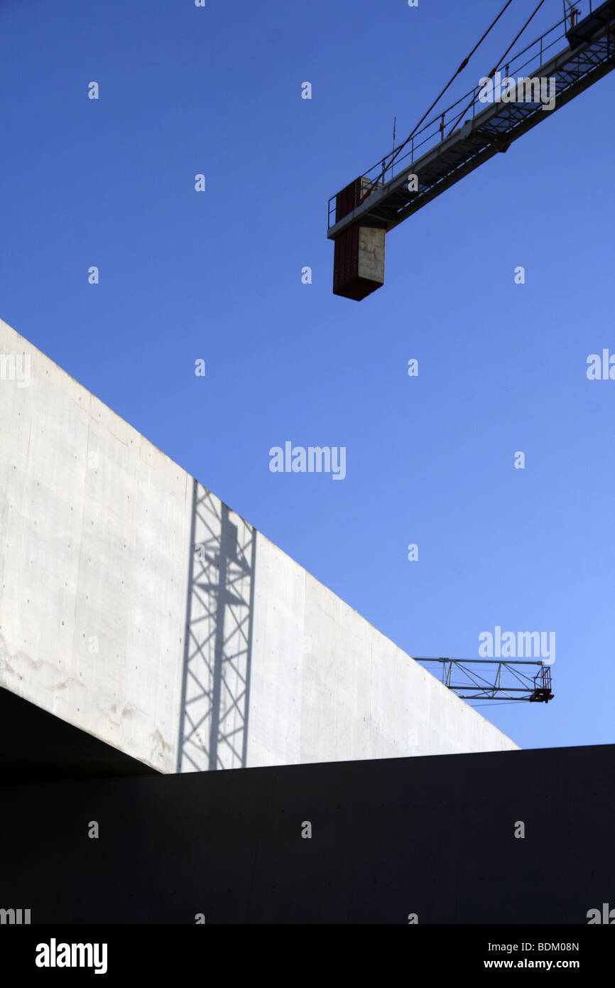 crane shadow on modern architecture building in sun Stock Photo - Alamy