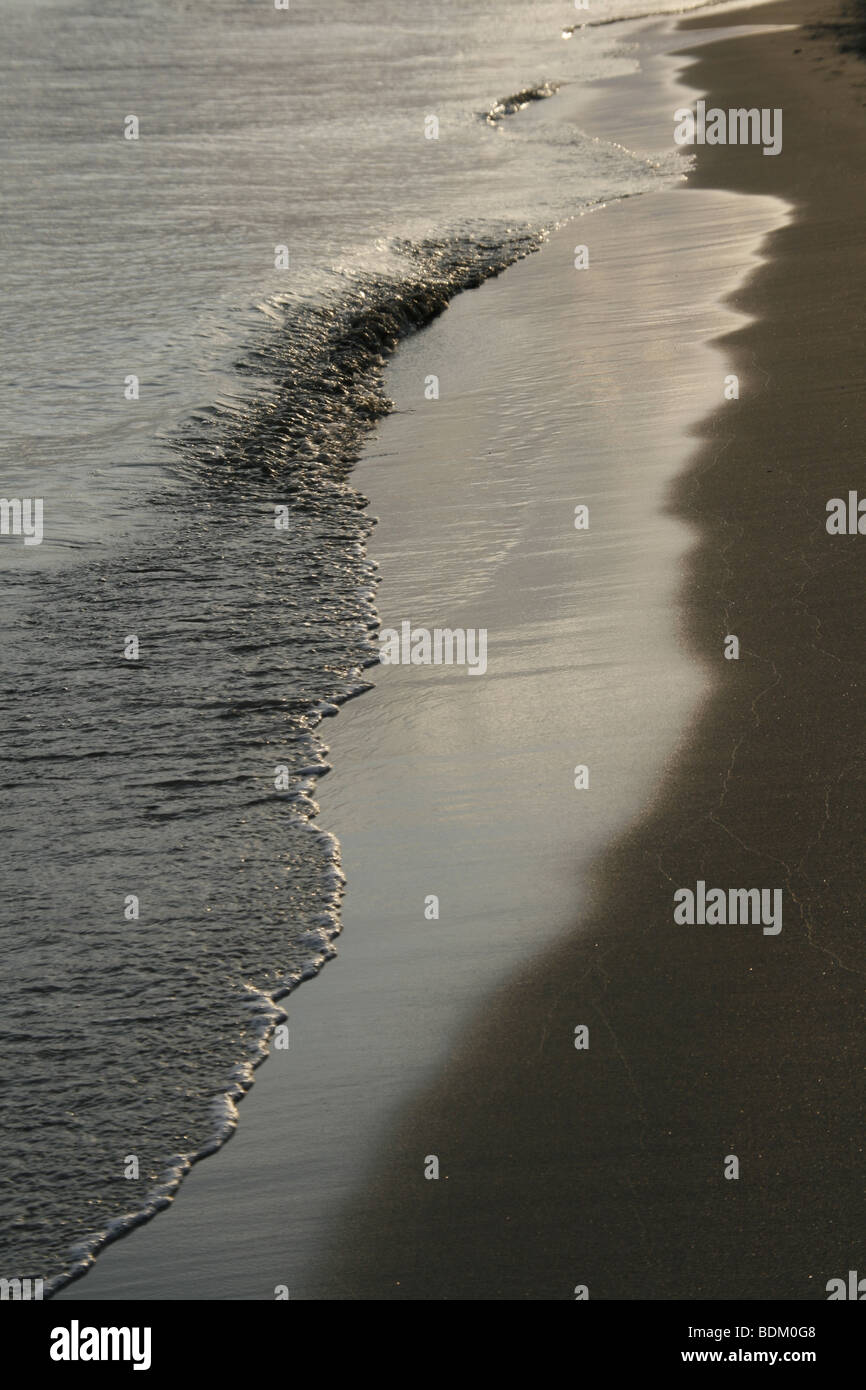 movement of sea waves on sand on beach coast shore Stock Photo - Alamy