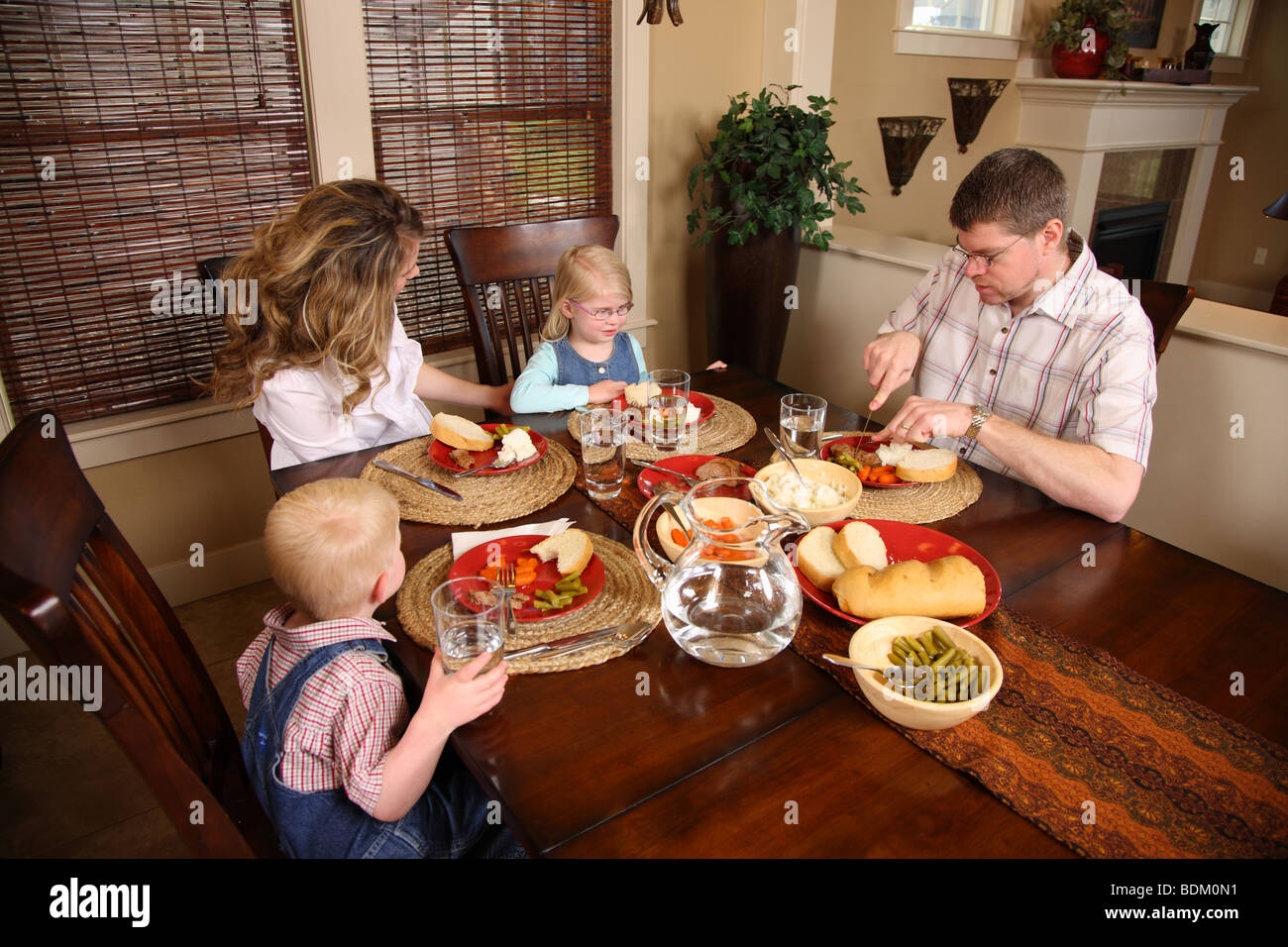 Family having dinner together Stock Photo - Alamy