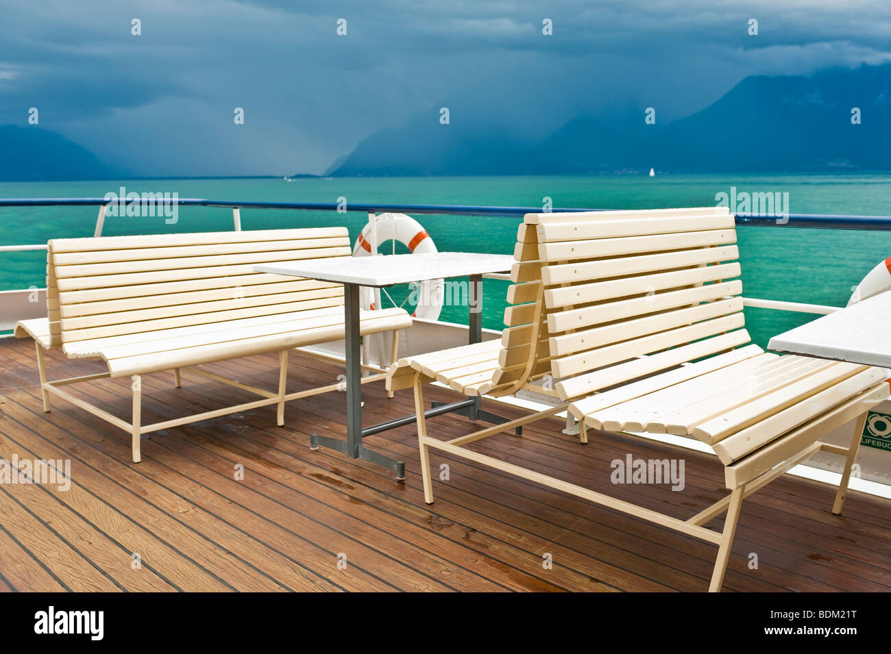 Benches and tables on a boat and tables on a boat Stock Photo - Alamy