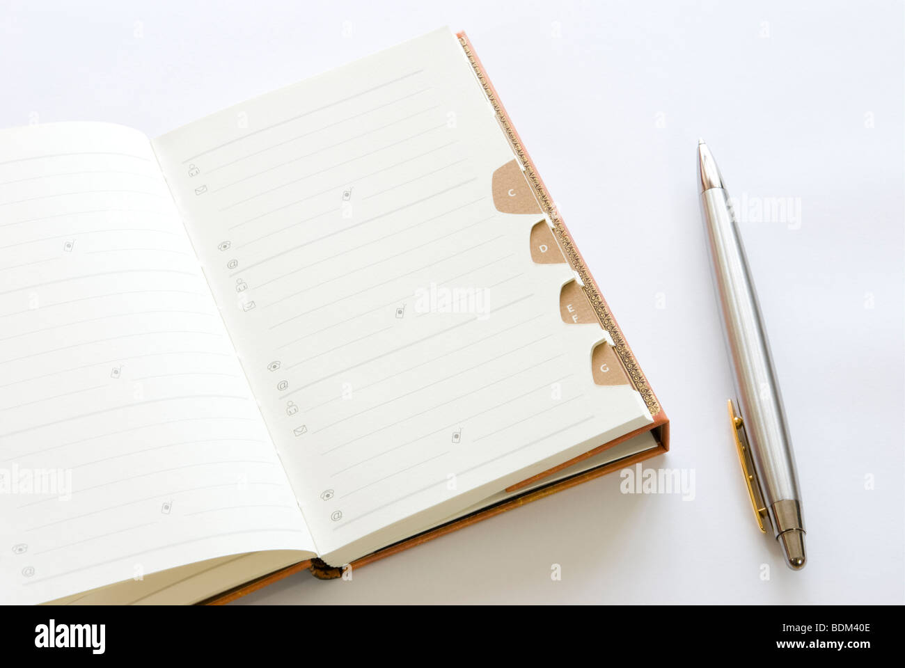 Address book with silver pen isolated on white background Stock Photo ...