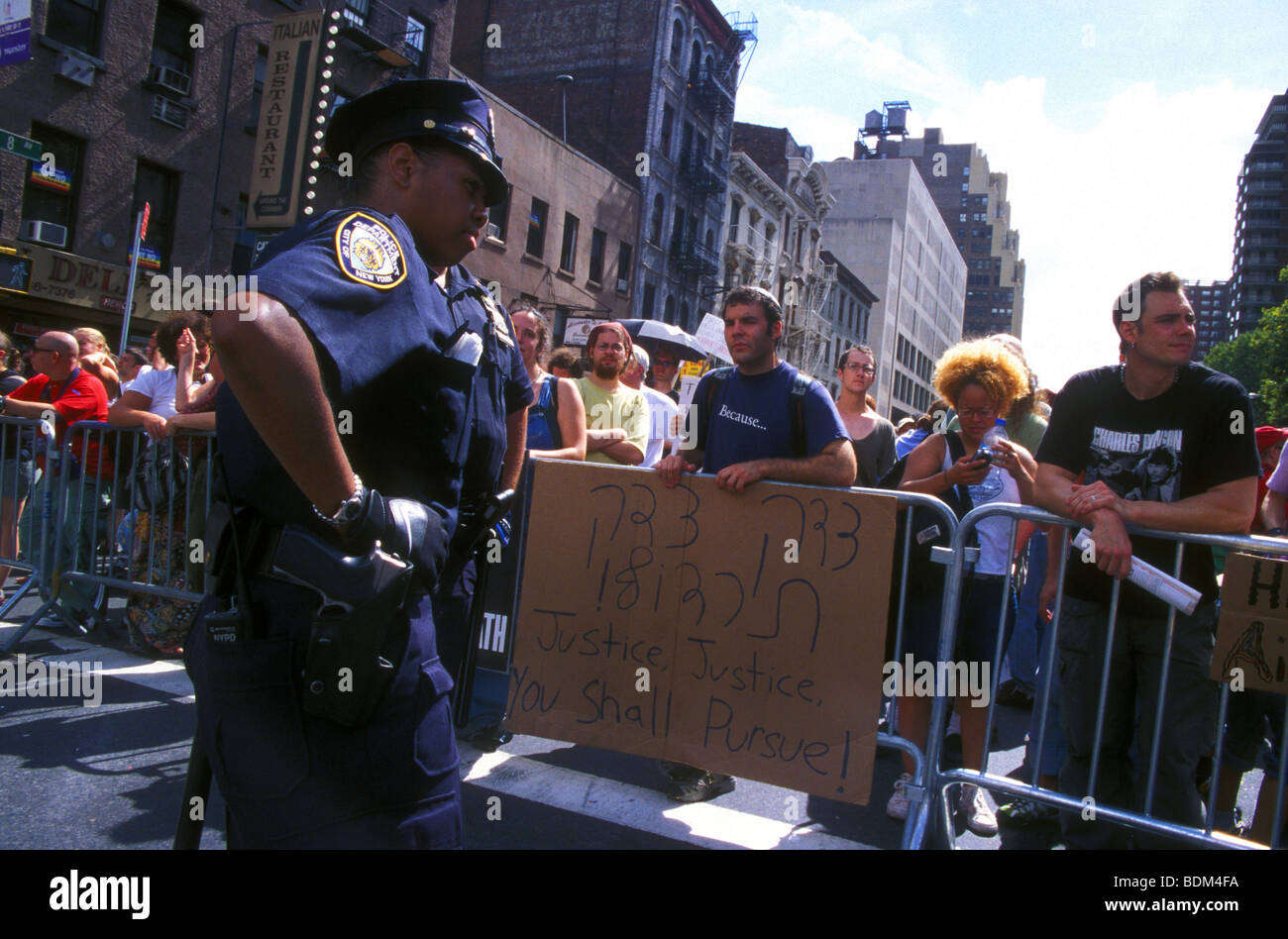 Black female police officer with the NYPD at a demo in New York City ...