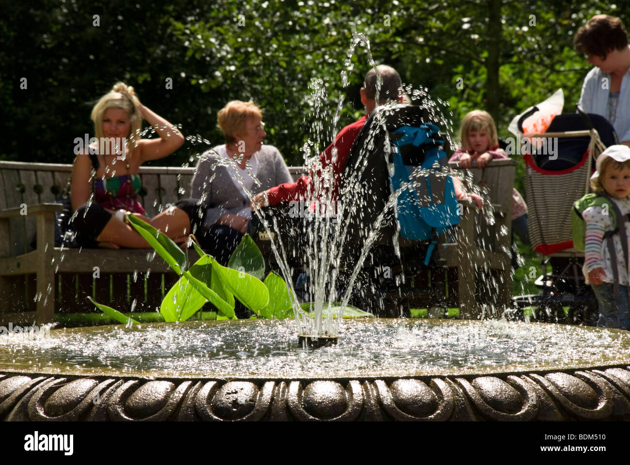 Family outing in a park Stock Photo - Alamy