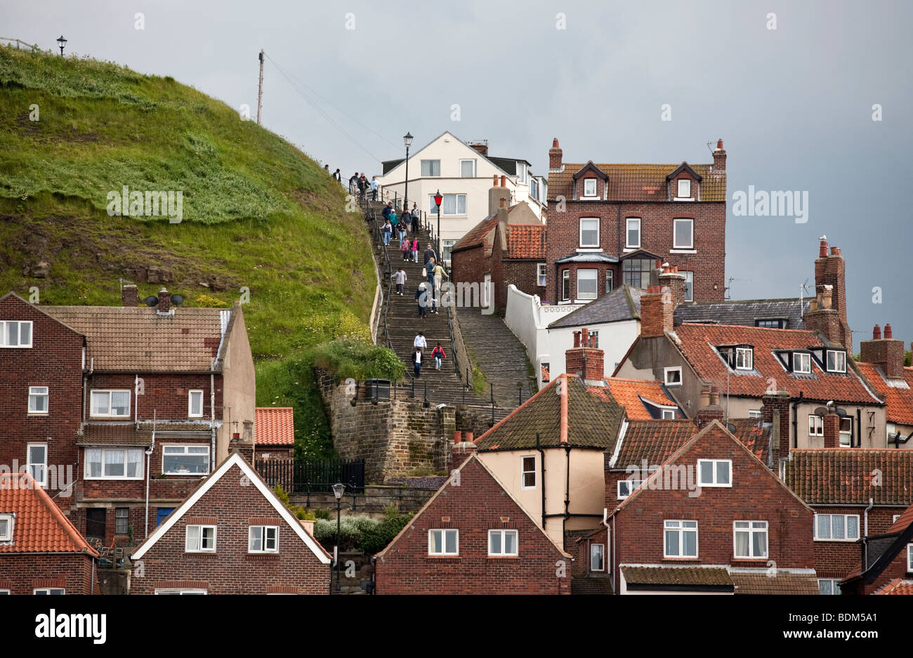 A view across the rooftops of Whitby showing the 100 steps climbing to ...