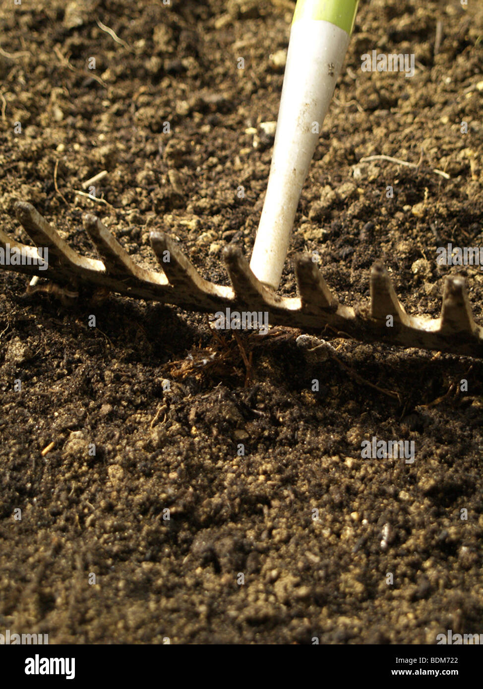 Rake soil hi-res stock photography and images - Alamy