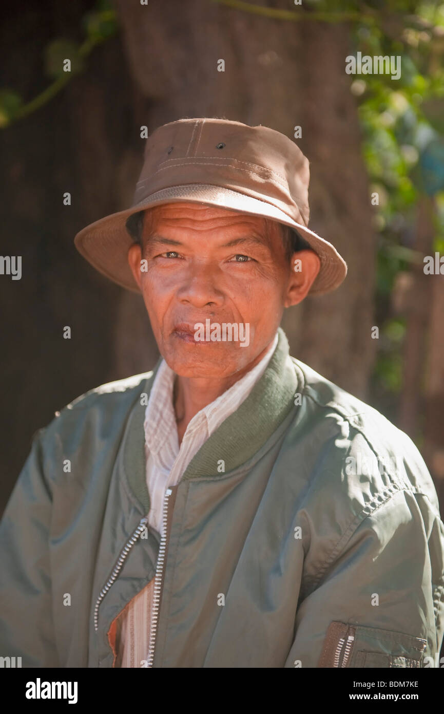 Bagan, Myanmar. Burmese man who is a guest at a village wedding looking ...