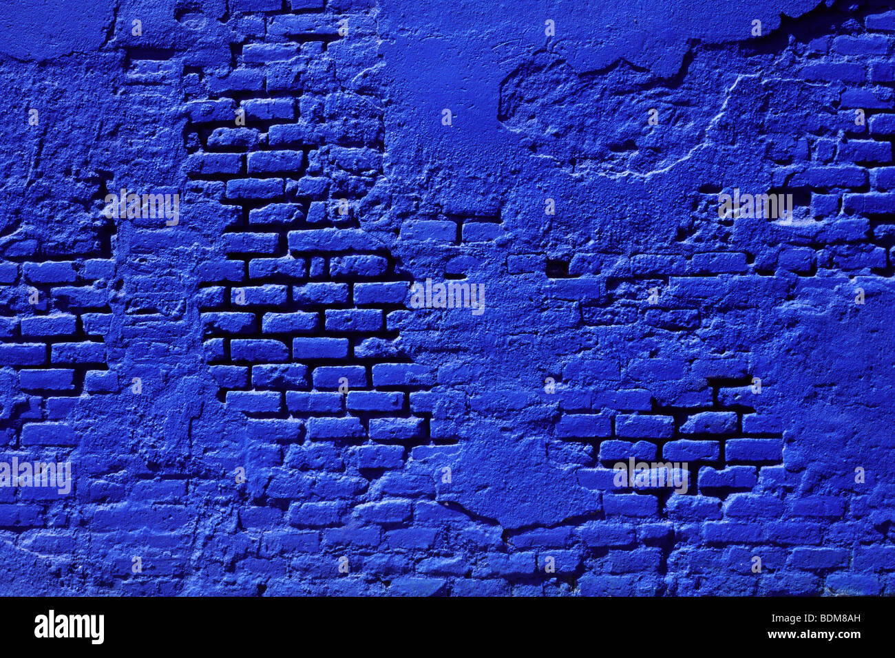 Damage blue wall at the Barcelona Stock Photo - Alamy
