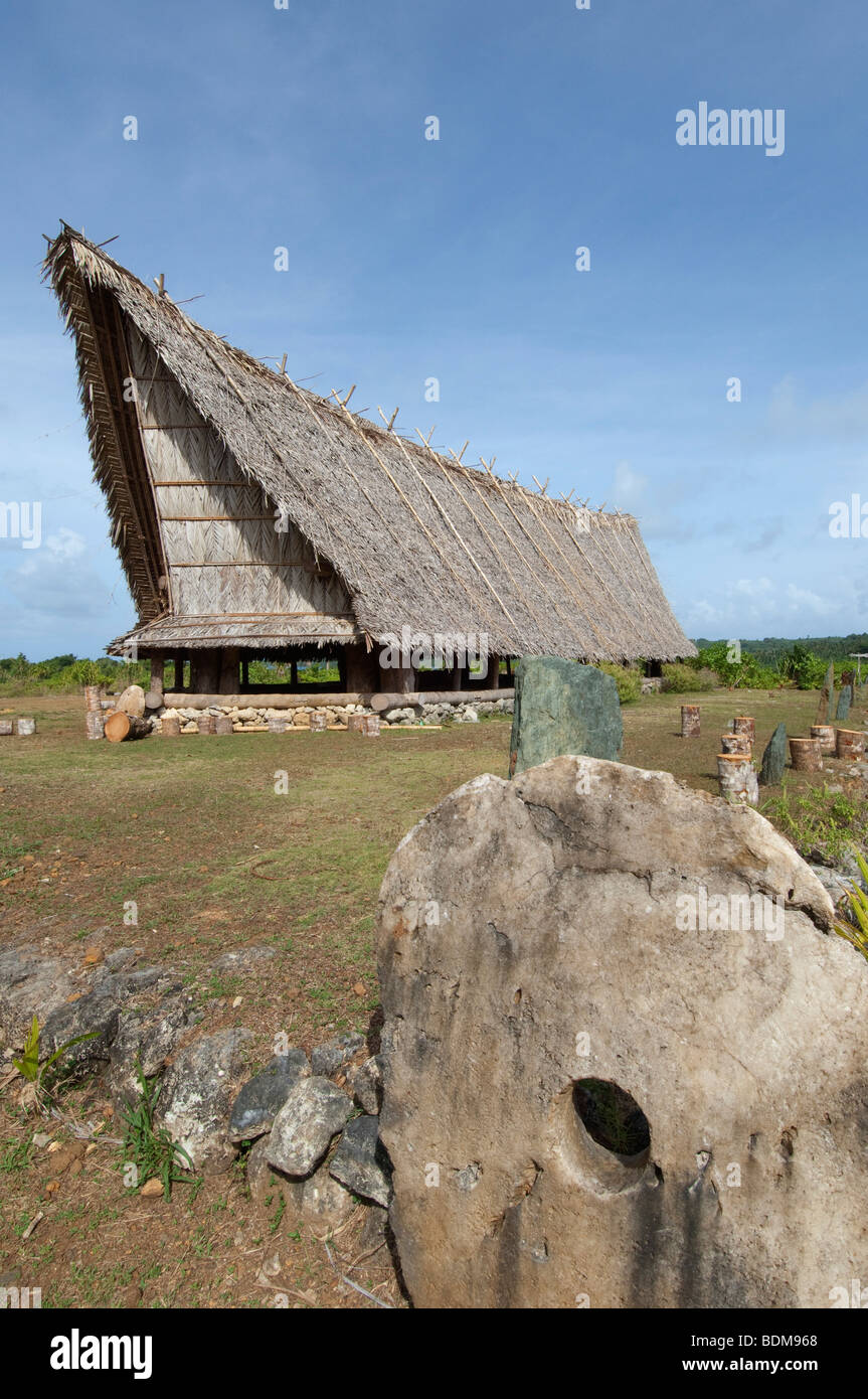 Stone money in front of the largest meeting house on the island of Yap ...
