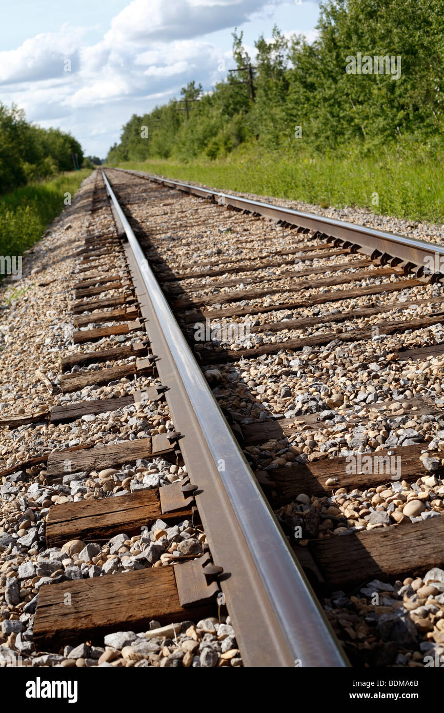 Rail road train tracks daytime Stock Photo - Alamy