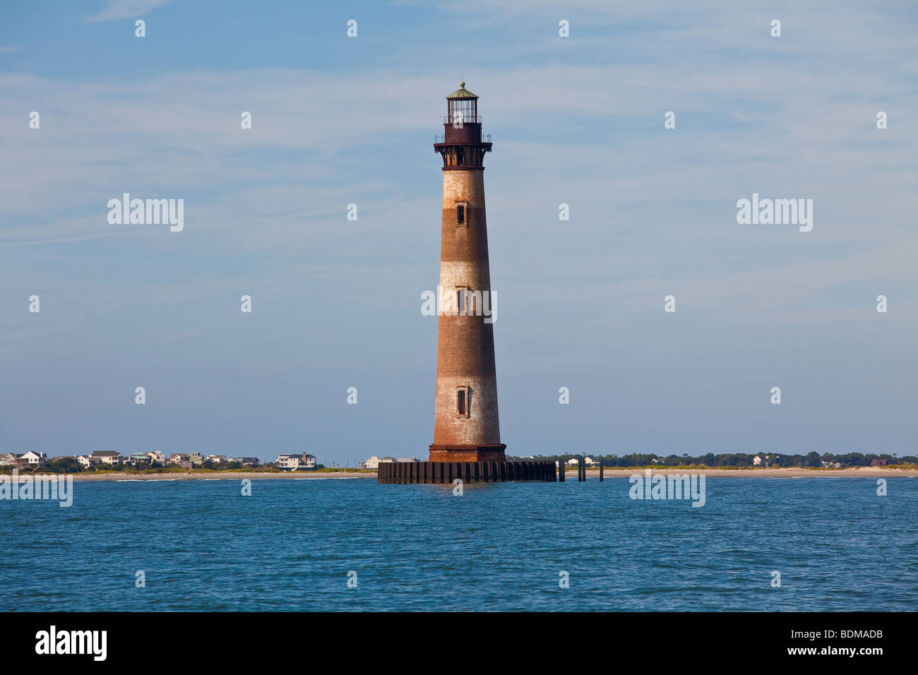 Historic Morris Island lighthouse surrounded by water in Charleston ...