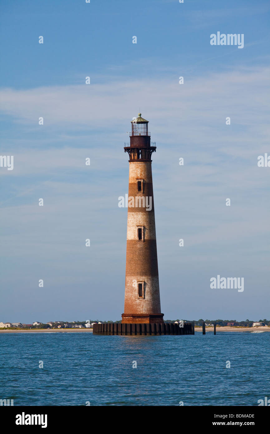 Historic Morris Island lighthouse surrounded by water in Charleston ...