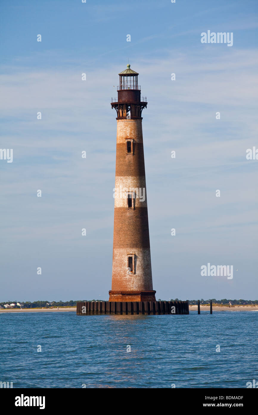 Historic Morris Island lighthouse surrounded by water in Charleston ...