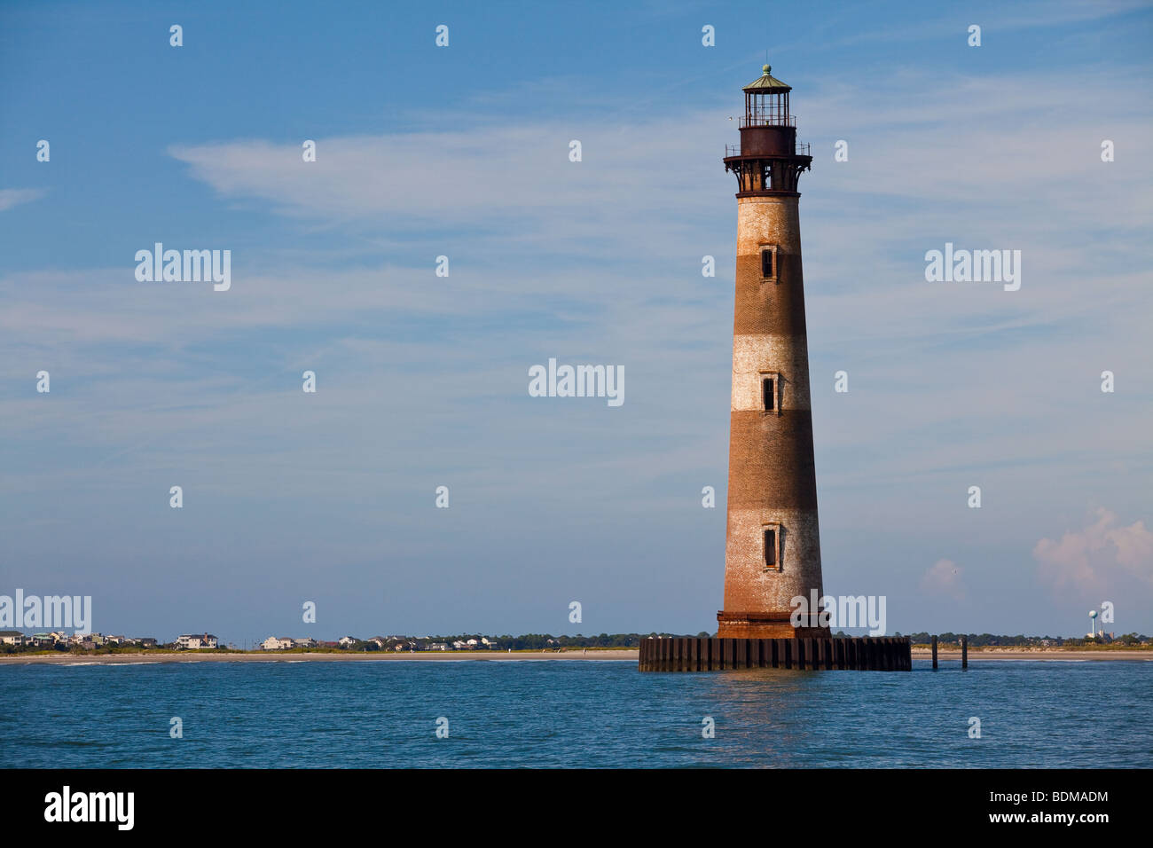 Historic Morris Island lighthouse surrounded by water in Charleston ...
