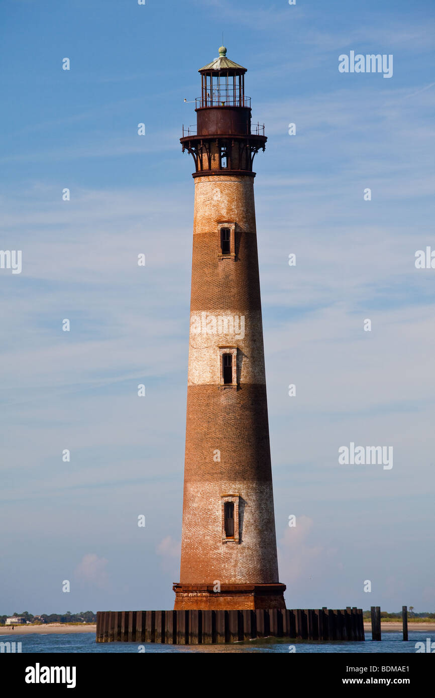 Historic Morris Island lighthouse surrounded by water in Charleston ...